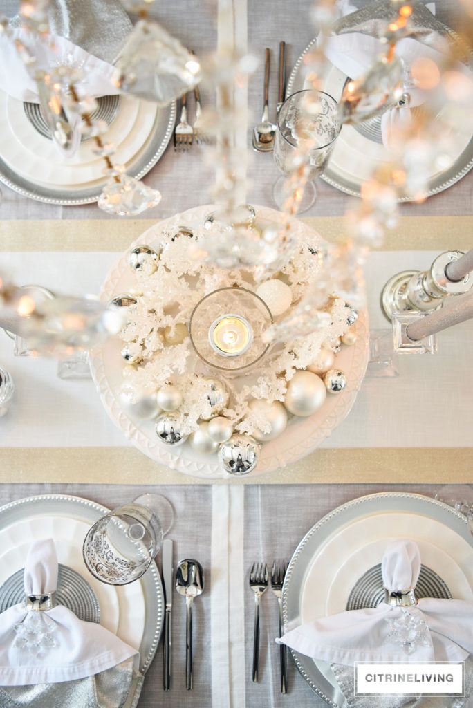A WINTER WHITE AND SILVER HOLIDAY TABLESCAPE